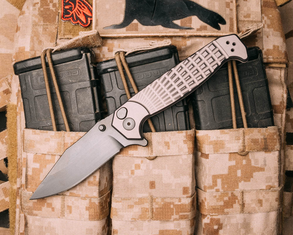 Crow Folder- Anodized Grey handle, Black Nitride blade, grenade stippl ...